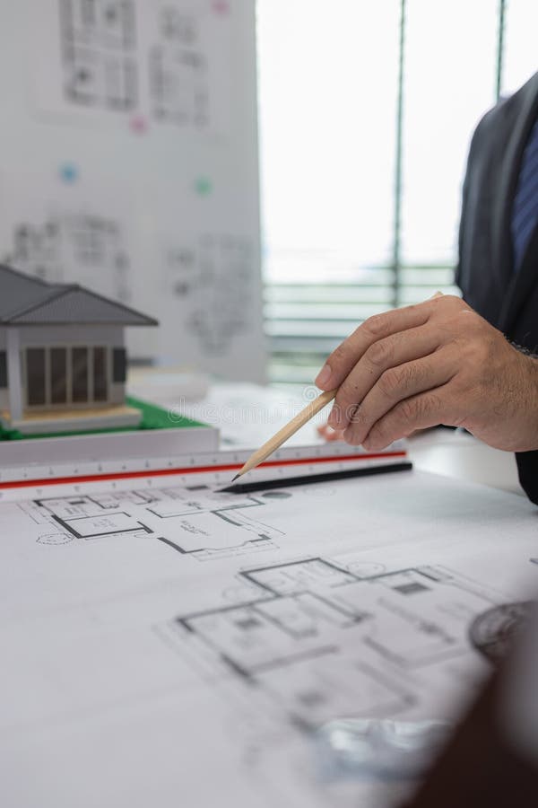 An Architect is Working in the Office, an Engineer in the Workplace ...