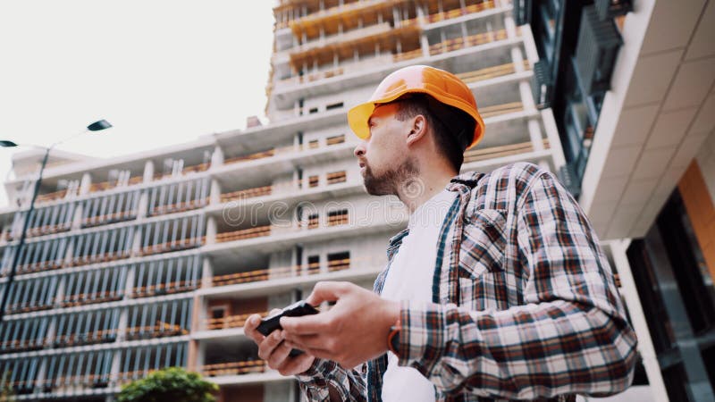 Architect Working with Smartphone on Construction Site. Engineer Check ...