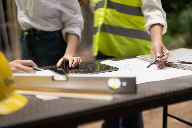 Architector and Engineers with Draft Plan of Building and Tablet ...