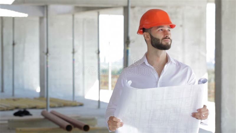 Architector Looks at the Plan of the Building Under Construction Stock ...