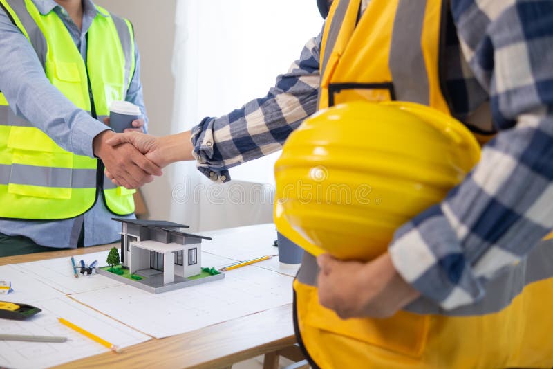 Architects and Construction Engineering Handshake after Meeting Discuss ...