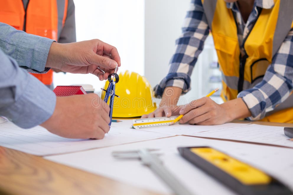 Architects and Construction Engineers Meet To Discuss Blueprints of ...