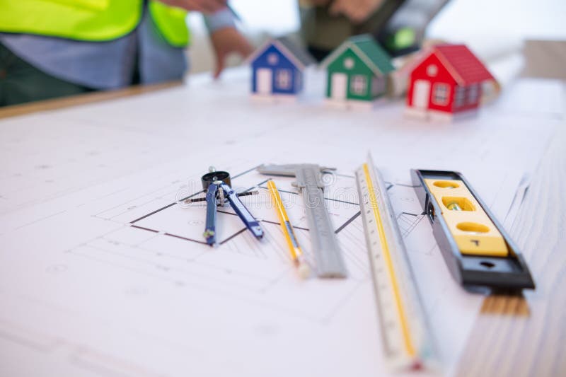 Architects and Construction Engineers Meet To Discuss Blueprints of ...