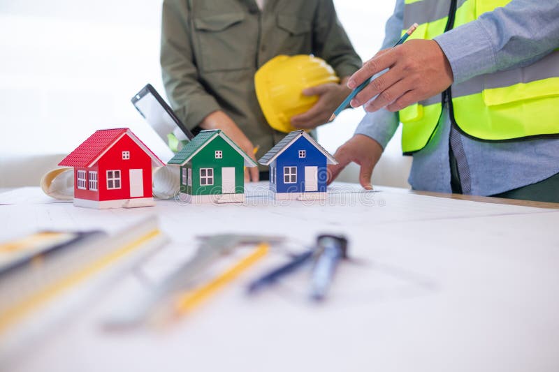 Architects and Construction Engineers Meet To Discuss Blueprints of ...