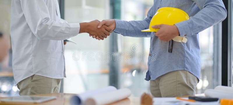 Architects and Contractors Shake Hands To Work Stock Photo - Image of ...