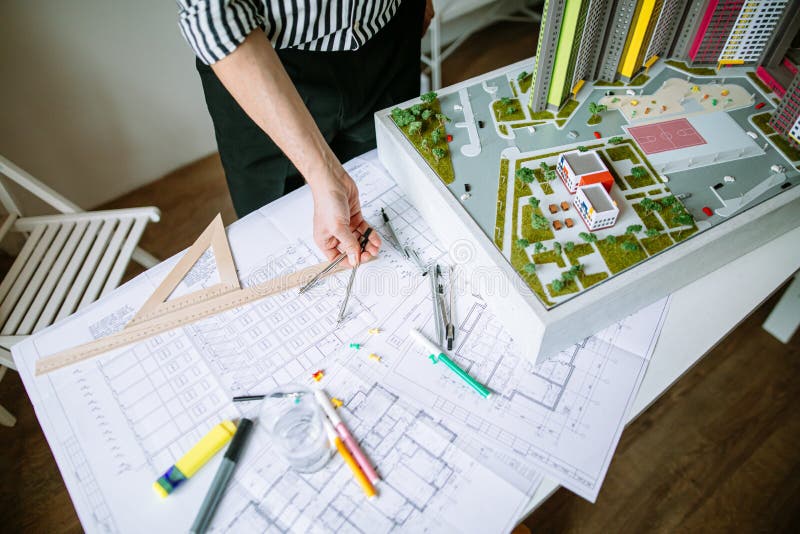 Architects Creating New Project with the Use of Small Model of High ...