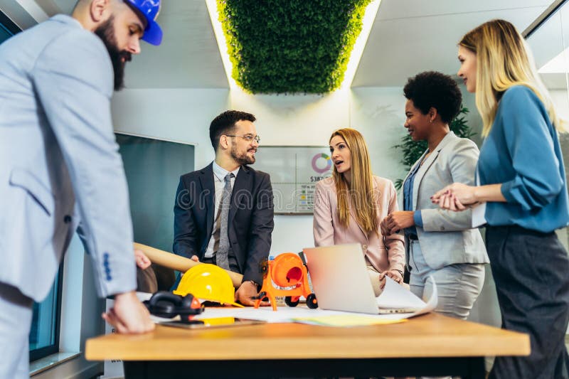 Architects, Designers and Engineers Working on Project Together in ...