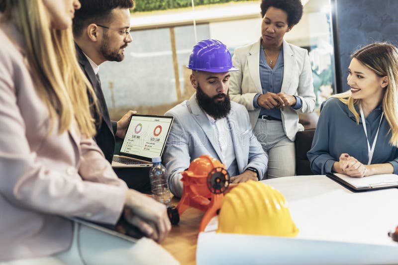 Architects, Designers and Engineers Working on Project Together in ...