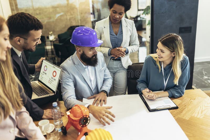 Architects, Designers and Engineers Working on Project Together in ...