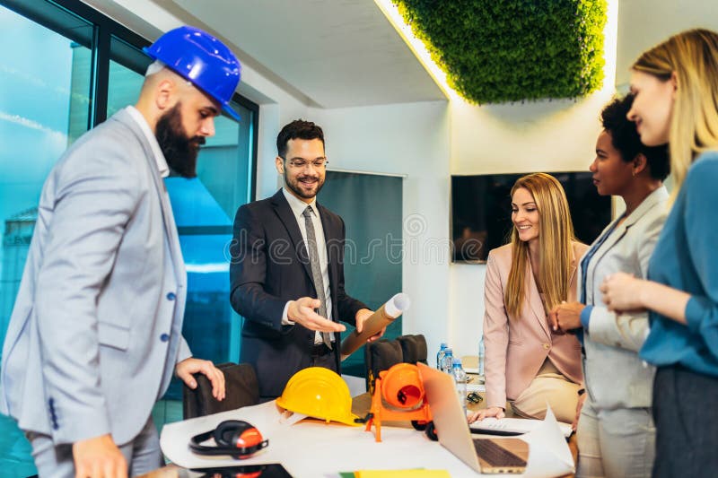 Architects, Designers and Engineers Working on Project Together in ...