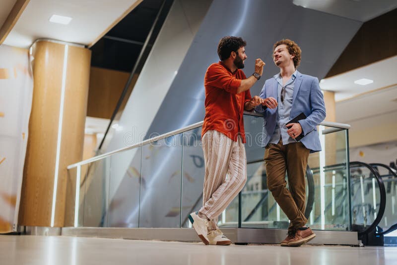 Successful Architects Discussing Project Details at Business Center ...