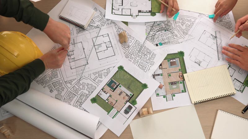 Architects Discuss about House Construction Design with Blueprint ...