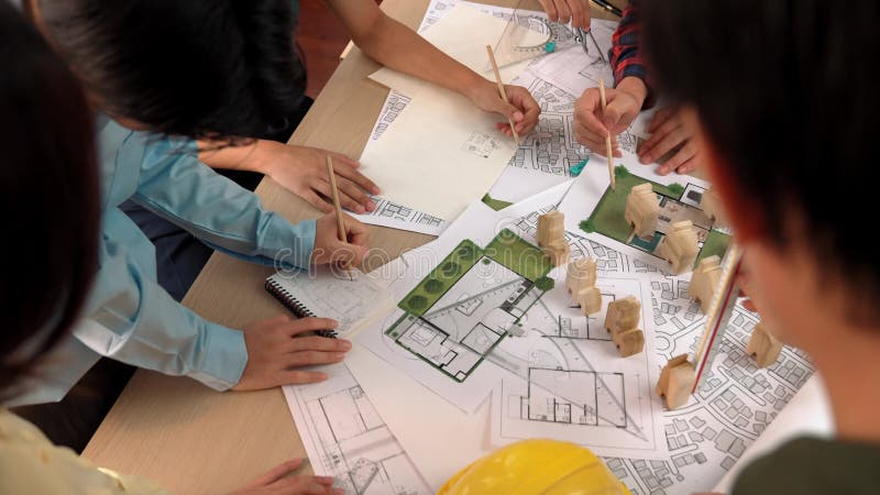 Architects Discuss about House Construction Design with Blueprint ...