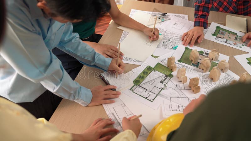 Architects Discuss about House Construction Design with Blueprint ...
