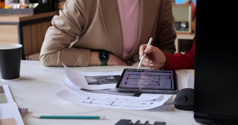 Architects Discussing Layout on Digital Tablet, Focusing on Floor Plan ...