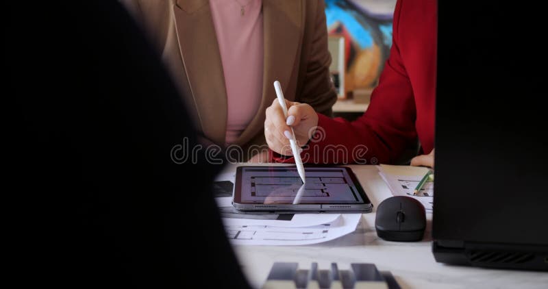 Architects Discussing Layout on Digital Tablet, Focusing on Floor Plan ...