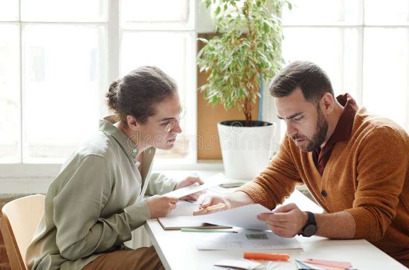 Architects Discussing Project in Studio Stock Photo - Image of ...