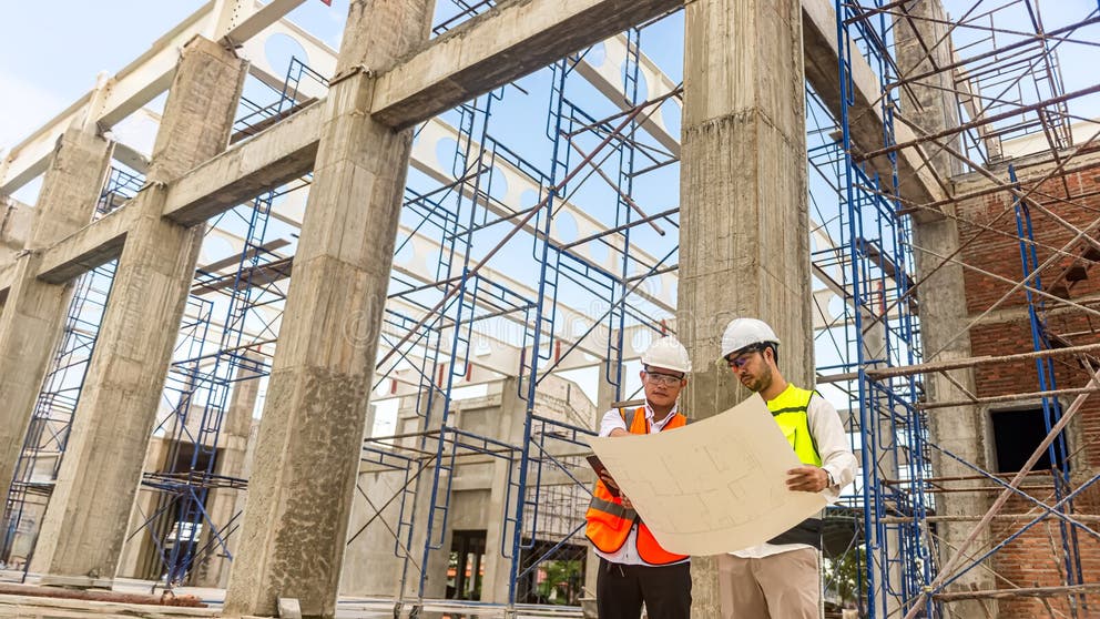 Architects Engineer are Checking the Progress of the Building Project ...