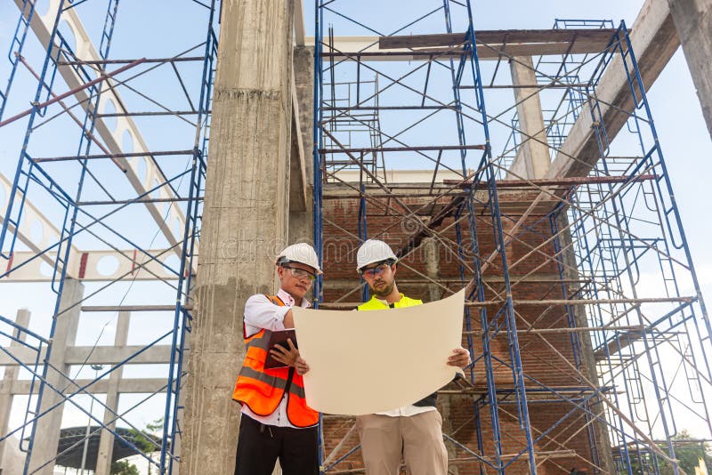 Architects Engineer are Checking the Progress of the Building Project ...