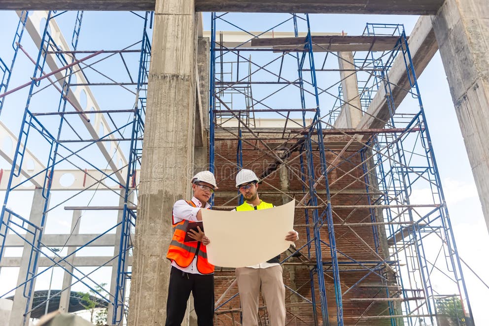 Architects Engineer are Checking the Progress of the Building Project ...