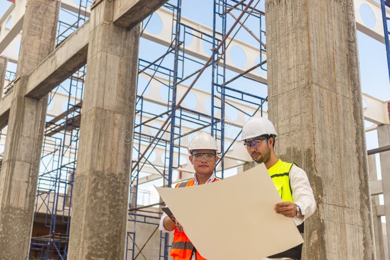 Architects Engineer are Checking the Progress of the Building Project ...