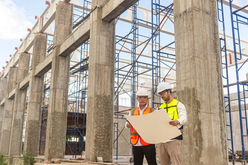 Architects Engineer are Checking the Progress of the Building Project ...