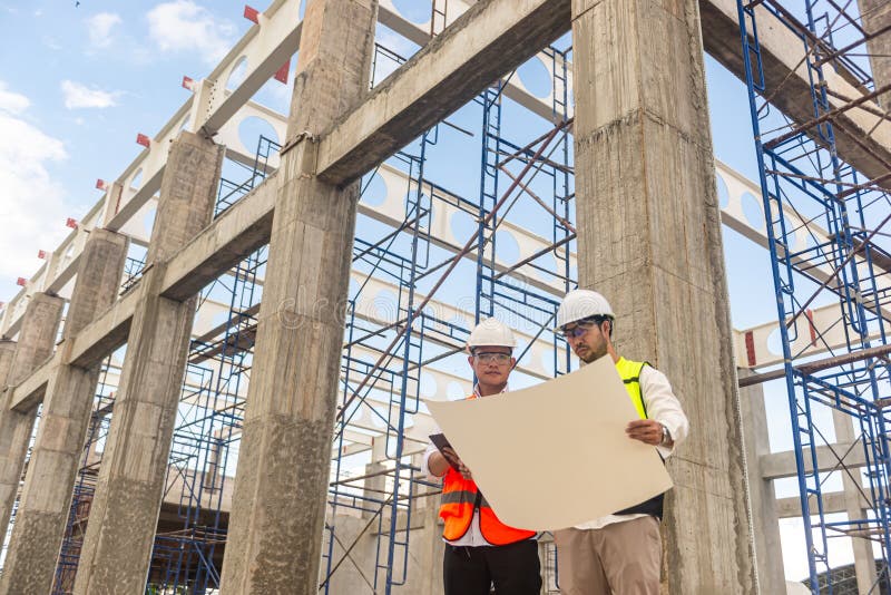 Architects Engineer are Checking the Progress of the Building Project ...