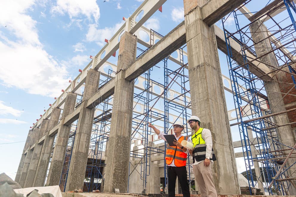 Architects Engineer are Checking the Progress of the Building Project ...