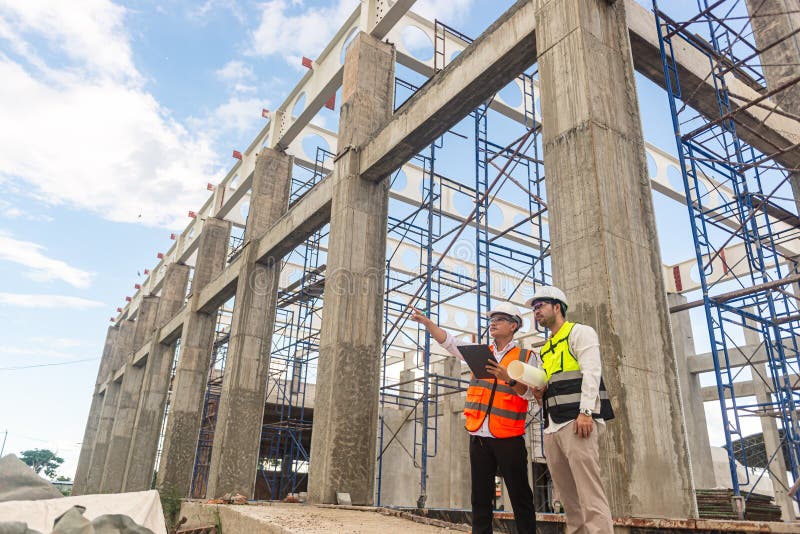 Architects Engineer are Checking the Progress of the Building Project ...