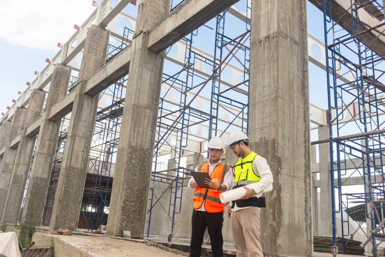 Architects Engineer are Checking the Progress of the Building Project ...