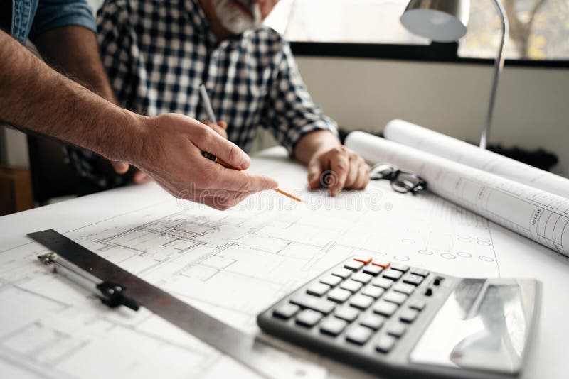 Engineer Drawing Plan on Blue Print with Architect Equipment ...