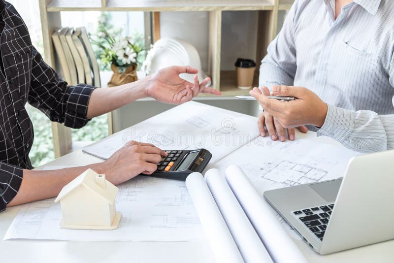 Architects or Engineering Team Consulting and Analyzing Working on ...