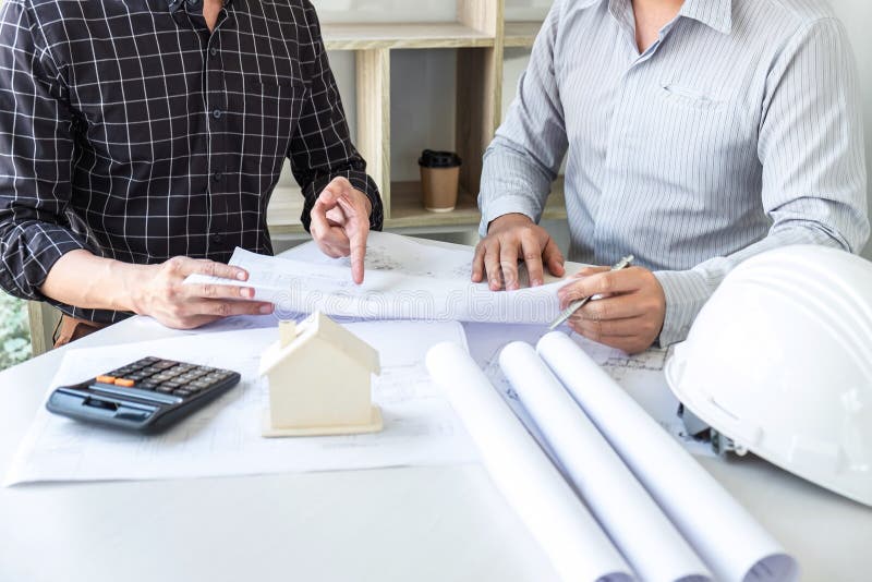 Architects or Engineering Team Consulting and Analyzing Working on ...