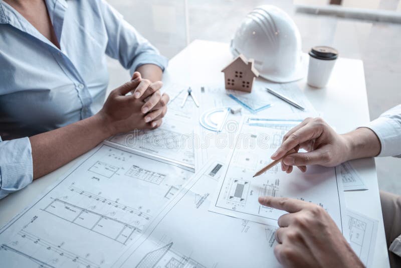 Architects or Engineering Team Consulting and Analyzing Working on ...