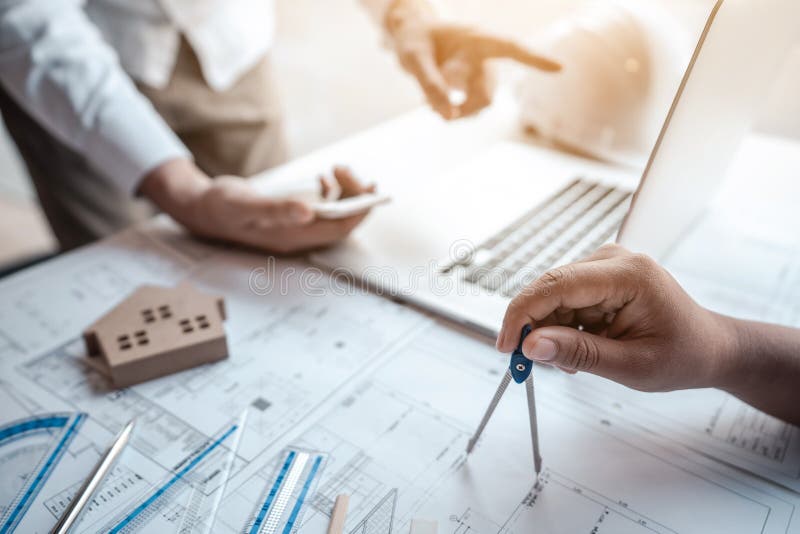 Architects or Engineering Team Consulting and Analyzing Working on ...