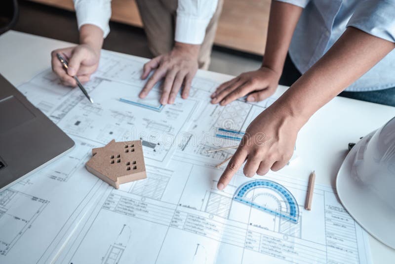 Architects or Engineering Team Consulting and Analyzing Working on ...