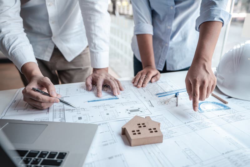 Architects or Engineering Team Consulting and Analyzing Working on ...