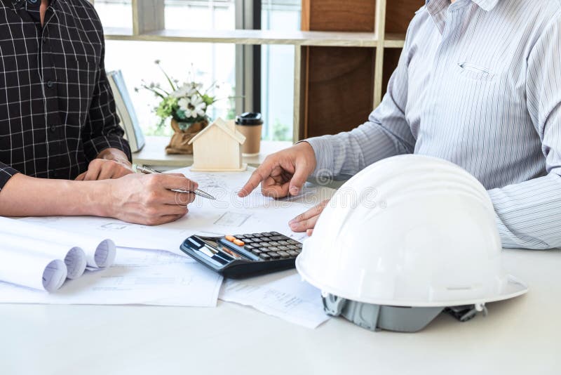 Architects or Engineering Team Consulting and Analyzing Working on ...