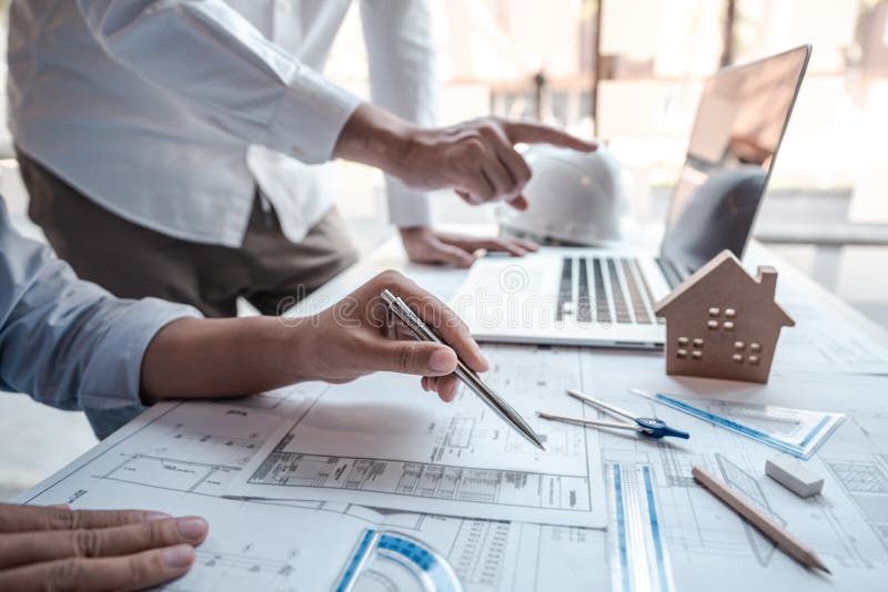 Architects or Engineering Team Consulting and Analyzing Working on ...