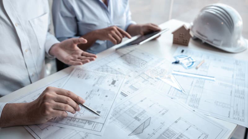 Architects or Engineering Team Consulting and Analyzing Working on ...