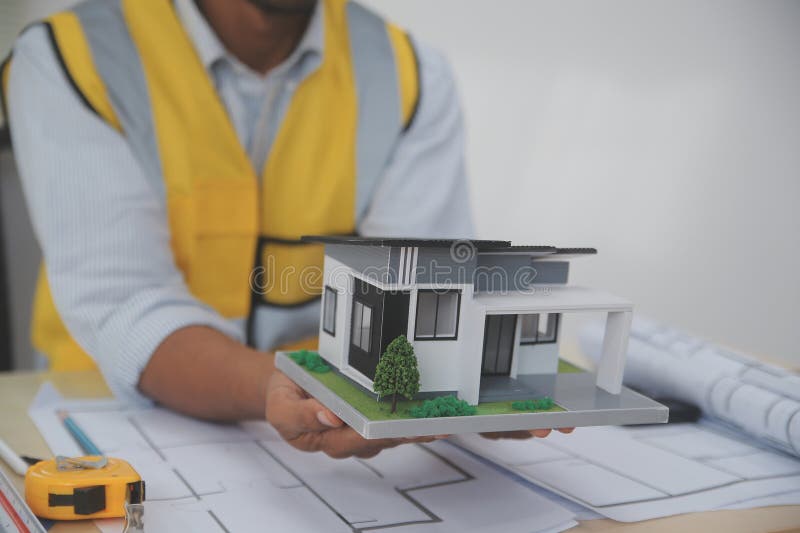 Architects, Engineers, Contractors Working in the Office with Blueprints, Inspection Engineers ...