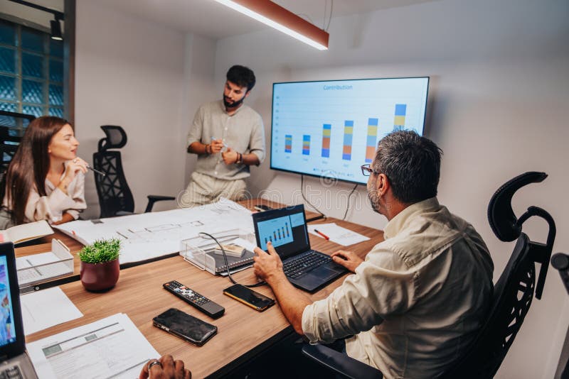 Team of Architects Discussing and Designing Sustainable Building ...