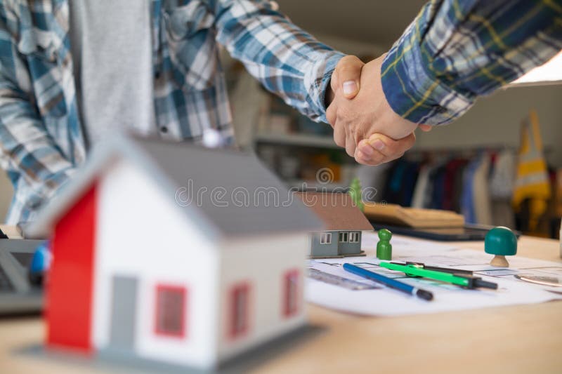 Architects and Engineers Join Hands To Congratulate when Discussing and ...