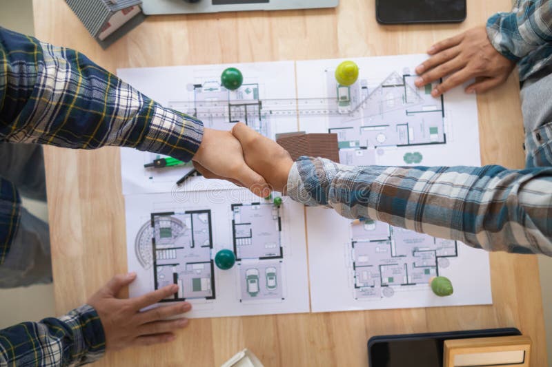 Architects and Engineers Join Hands To Congratulate when Discussing and ...