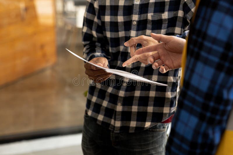 Architects and Engineers Stand by To Discuss Building Plan Documents ...