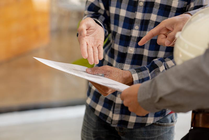 Architects and Engineers Stand by To Discuss Building Plan Documents ...