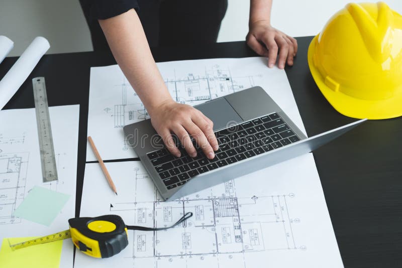 Architects or Engineers Working Construction and Drawing Construction ...