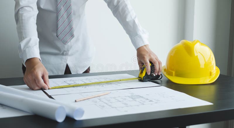 Architects or Engineers Working Construction and Drawing Construction ...