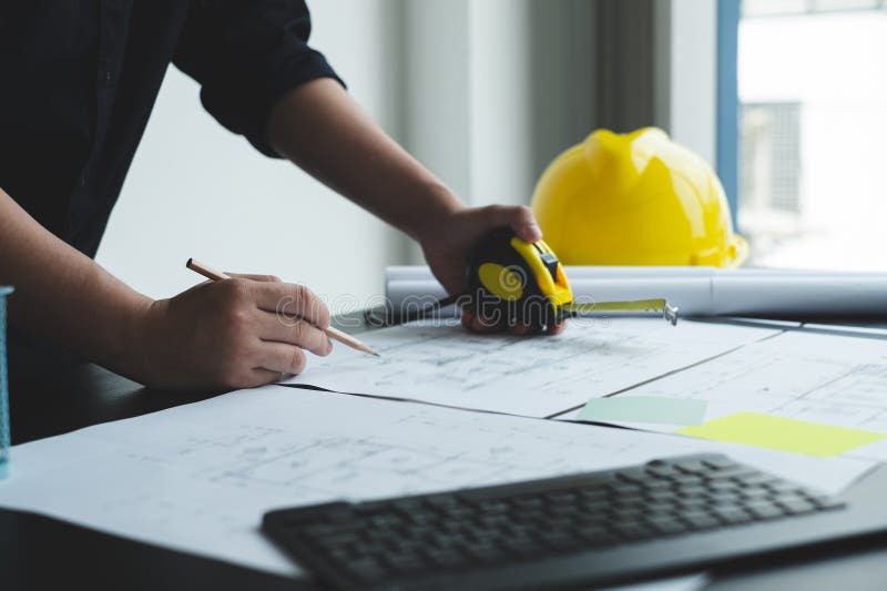 Architects or Engineers Working Construction and Drawing Construction ...