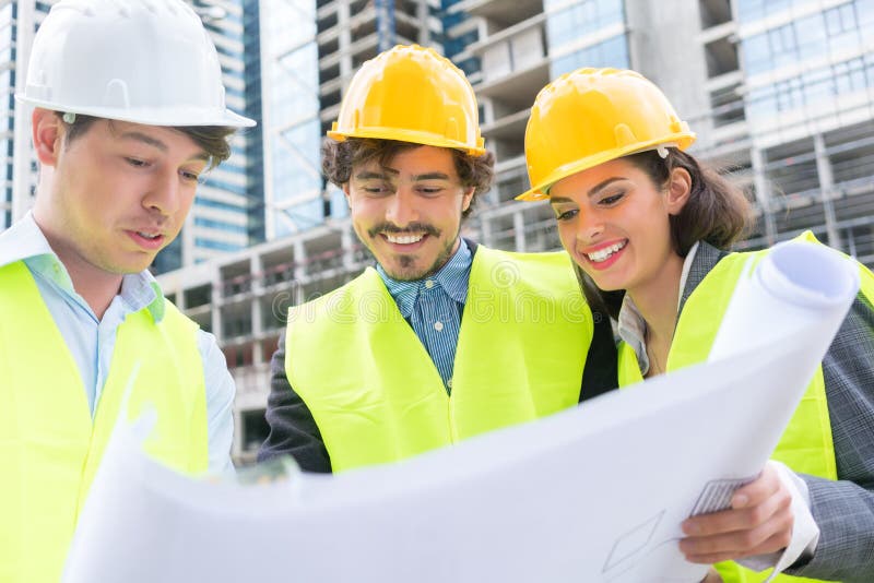 Architects with Ground Plot on Construction Site Stock Image - Image of ...